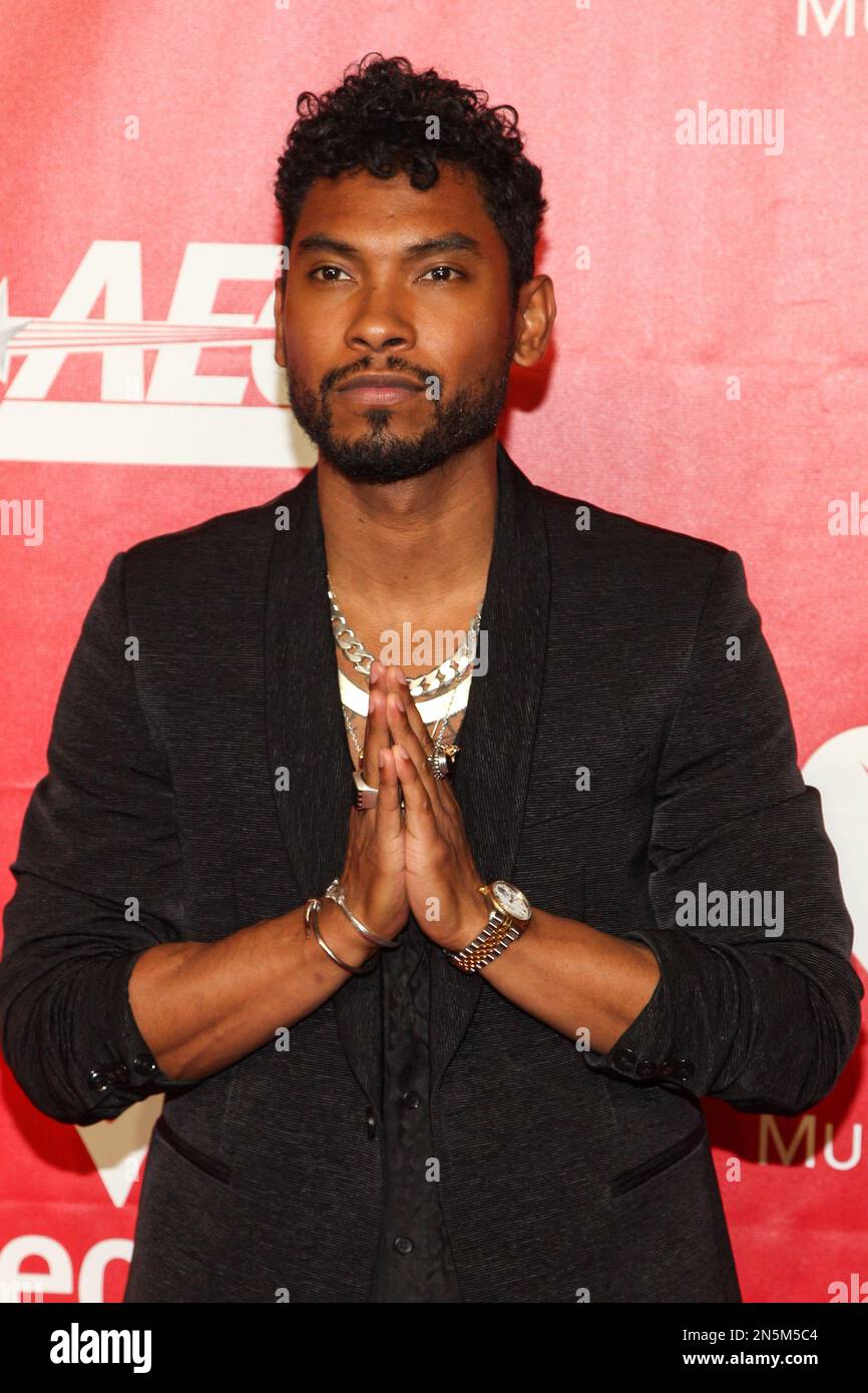 Singer Miguel arrives at the MusiCares 2014 Person of the Year Tribute ...