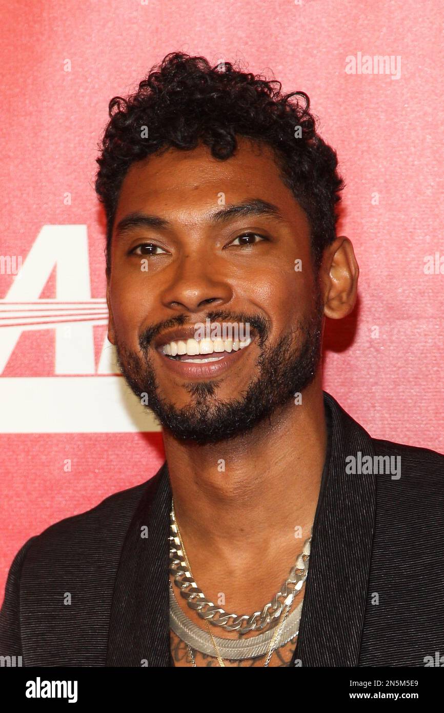 Singer Miguel arrives at the MusiCares 2014 Person of the Year Tribute ...