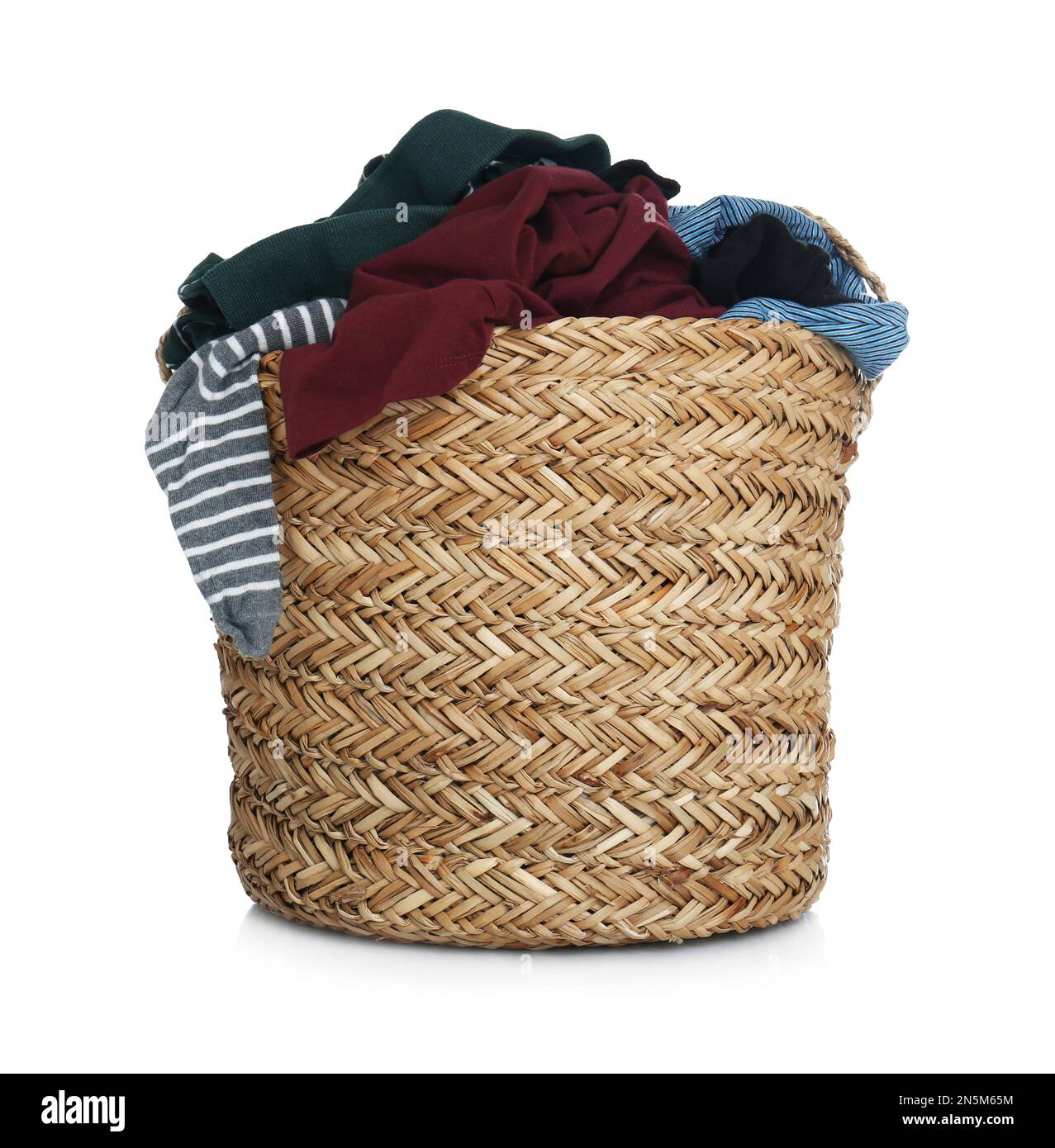 Wicker laundry basket with clothes isolated on white Stock Photo - Alamy