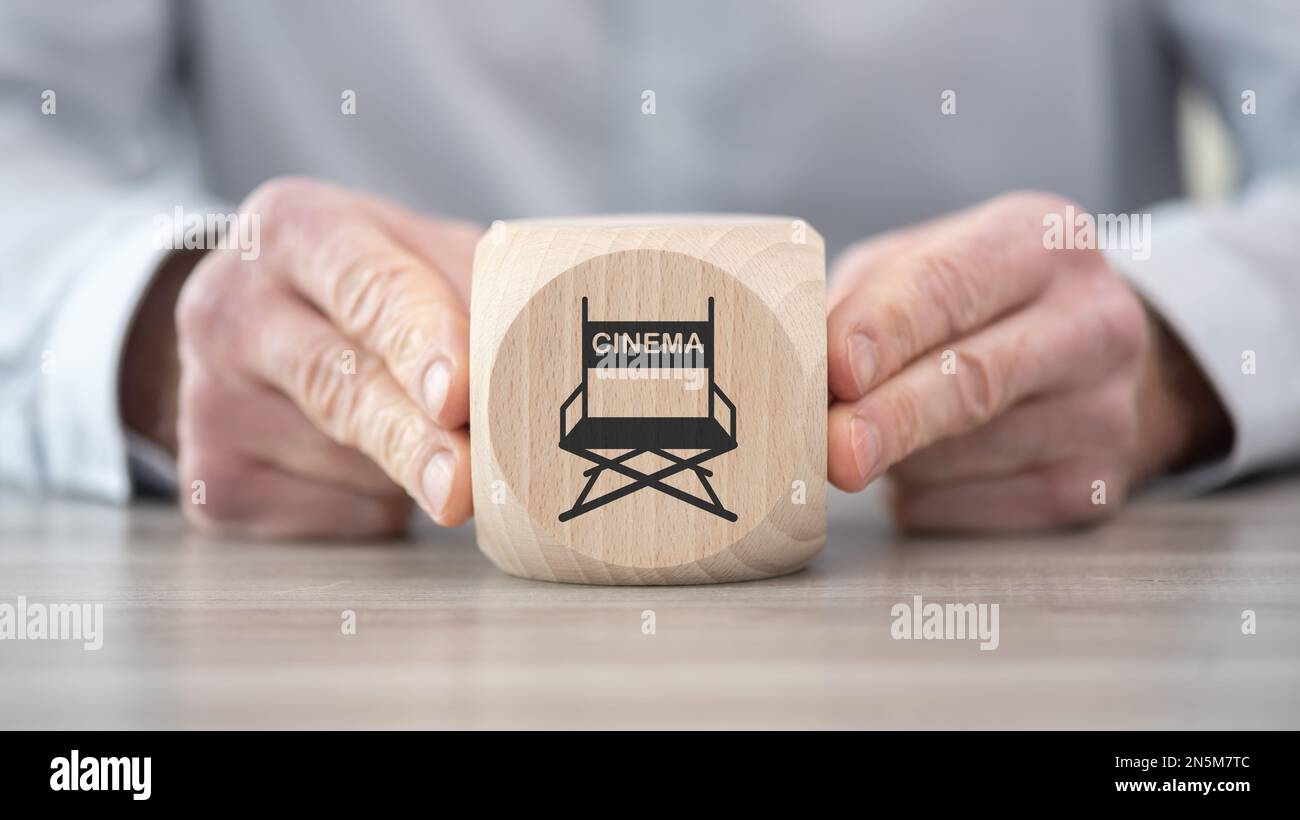 Wooden block with symbol of cinema concept Stock Photo - Alamy