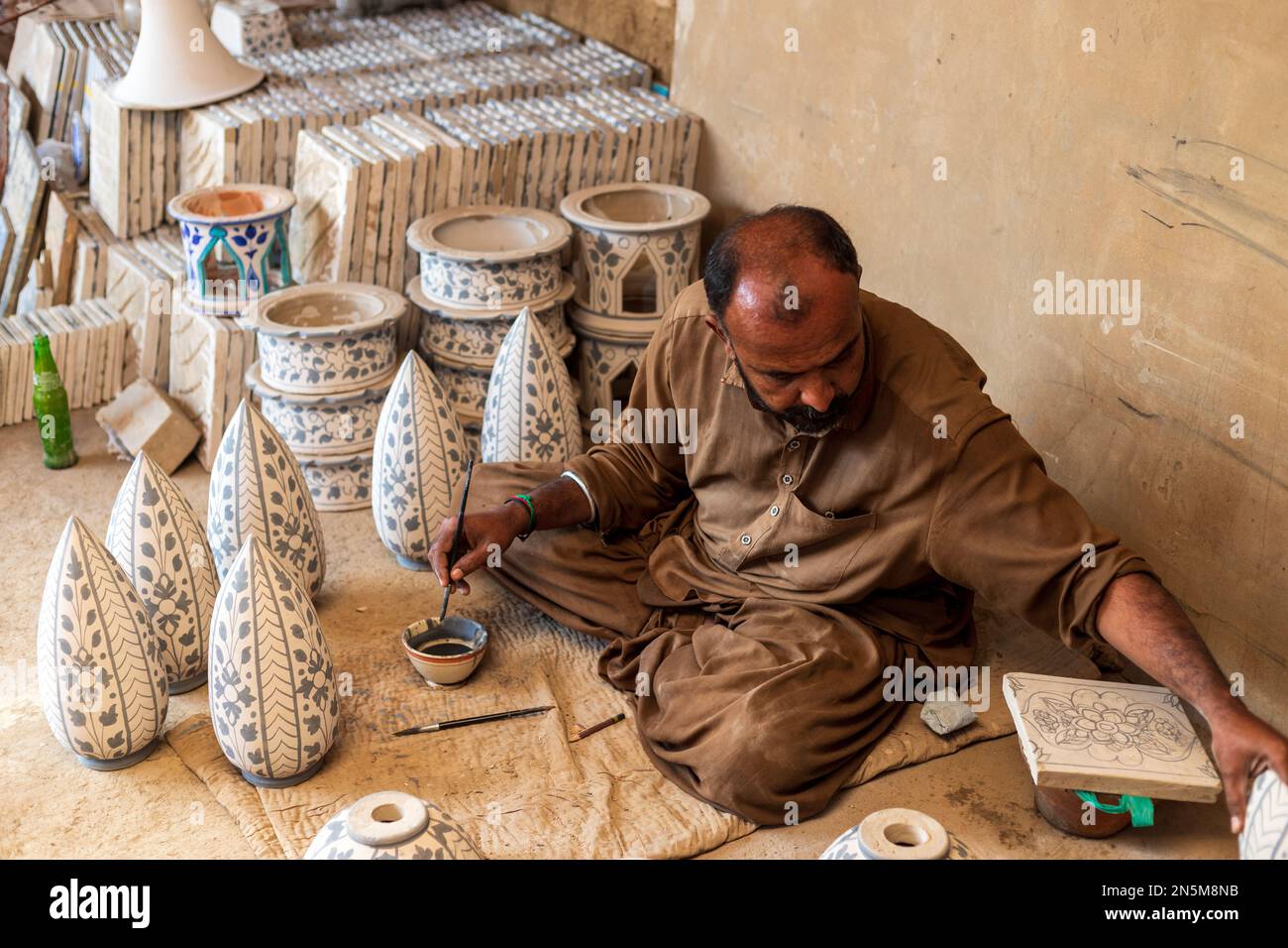 Hala Sindh 2022, Man is making Colorful clay pots in Hala Sindh, also ...