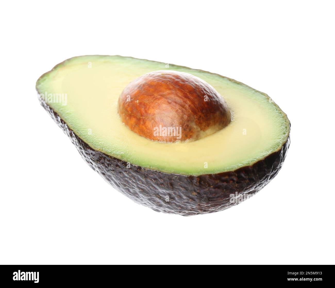 Half of ripe avocado with pit isolated on white Stock Photo - Alamy