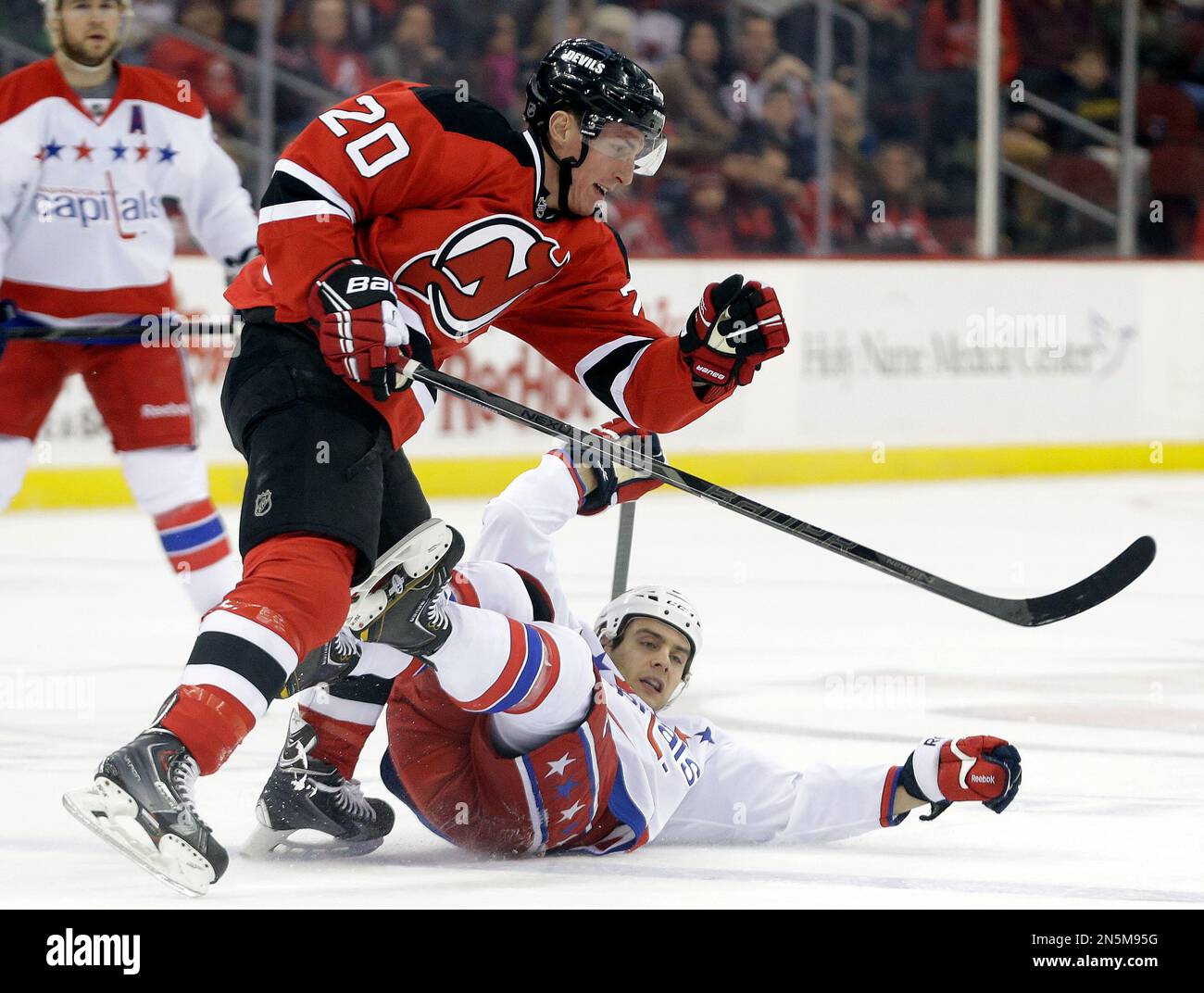 Washington Capitals left wing Aaron Volpatti, bottom, is leveled by New ...
