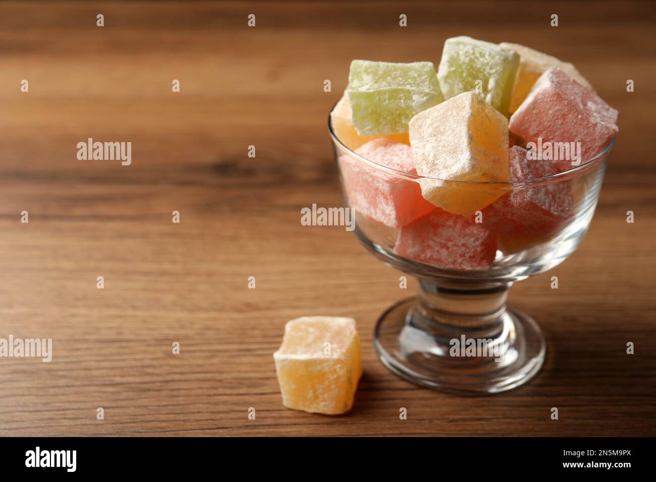 Turkish delight dessert on wooden table. Space for text Stock Photo - Alamy