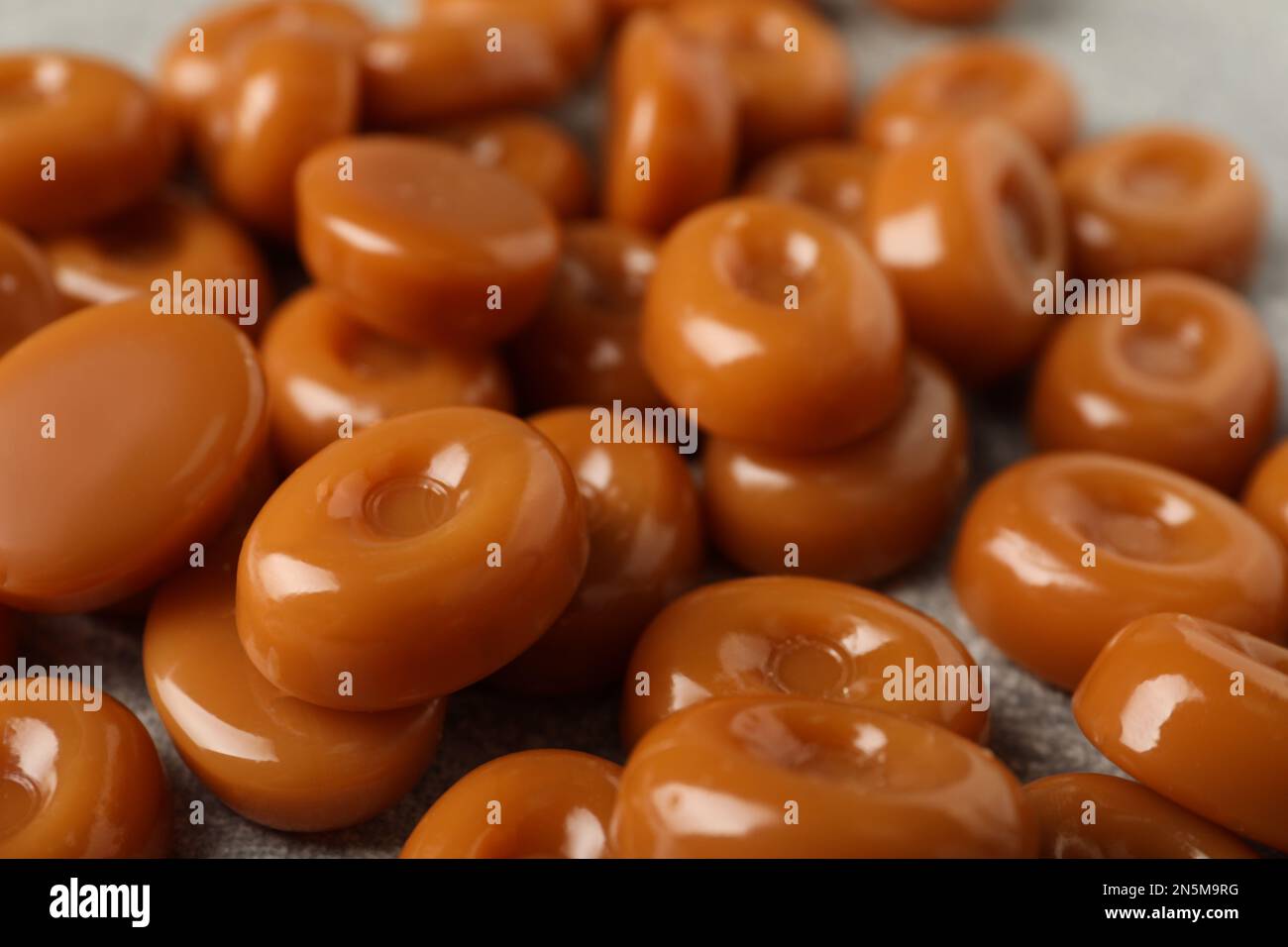 Tasty hard toffee candies on table, closeup Stock Photo - Alamy