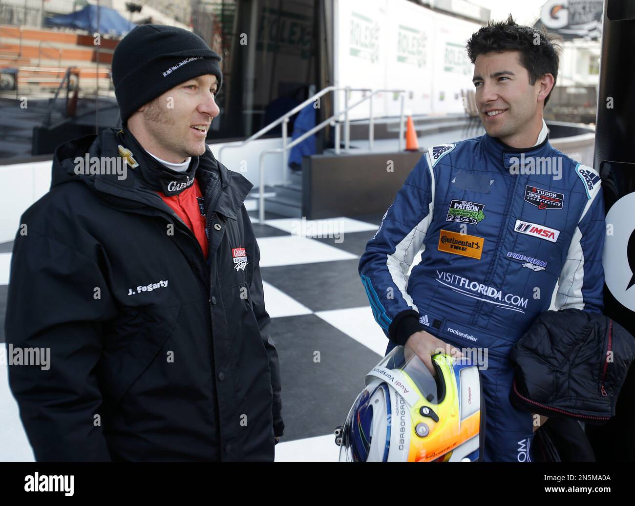 Jon Fogarty, left, and Mike Rockenfeller, of Germany, talk after a ...