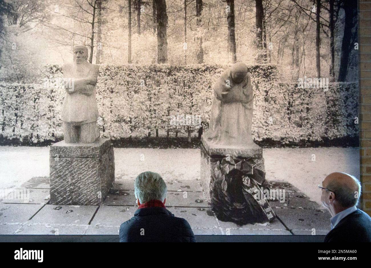 Visitors view a photo of the 'Grieving Parents' statue during an ...