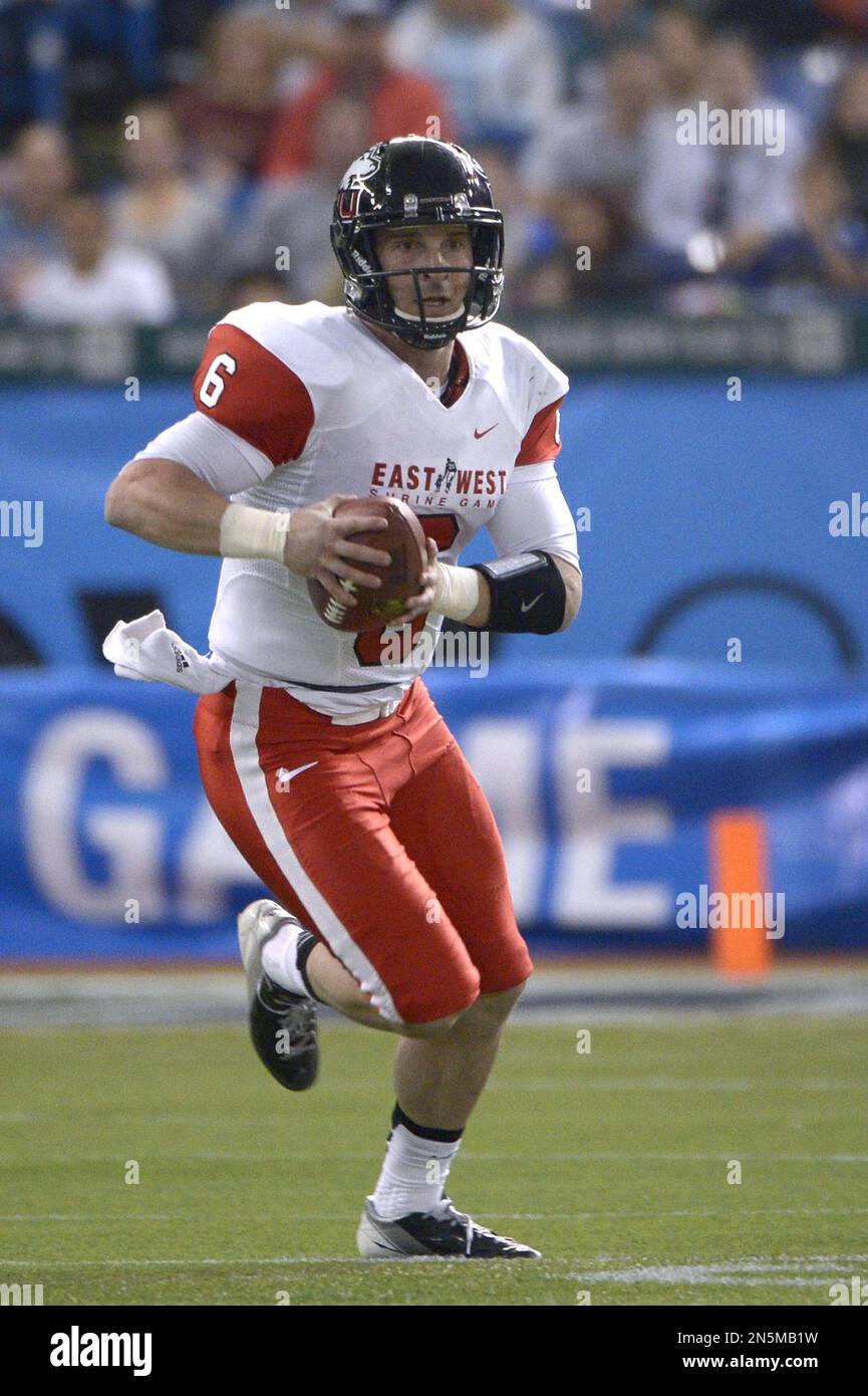 East quarterback Jordan Lynch (6), of Northern Illinois, scrambles for ...