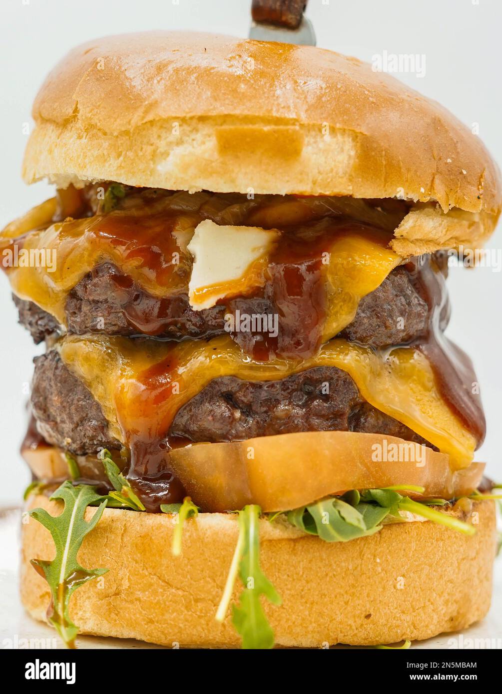 Tremendous double burger with extra cheddar cheese Stock Photo - Alamy