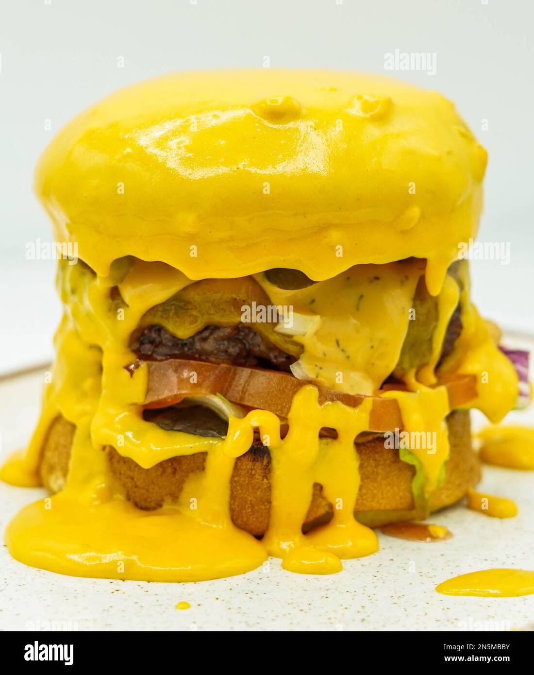 Tremendous double burger with extra cheddar cheese Stock Photo - Alamy