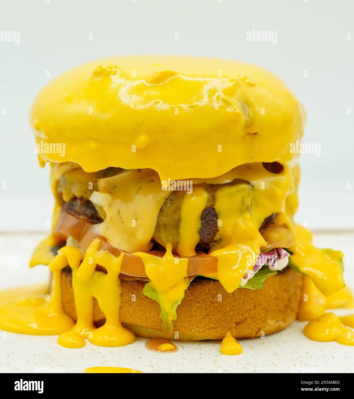 Tremendous double burger with extra cheddar cheese Stock Photo - Alamy