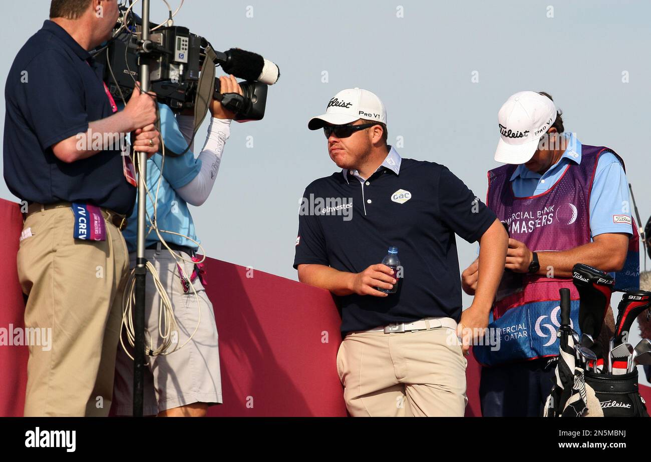 George Coetzee of South Africa, center, takes a break during the third ...