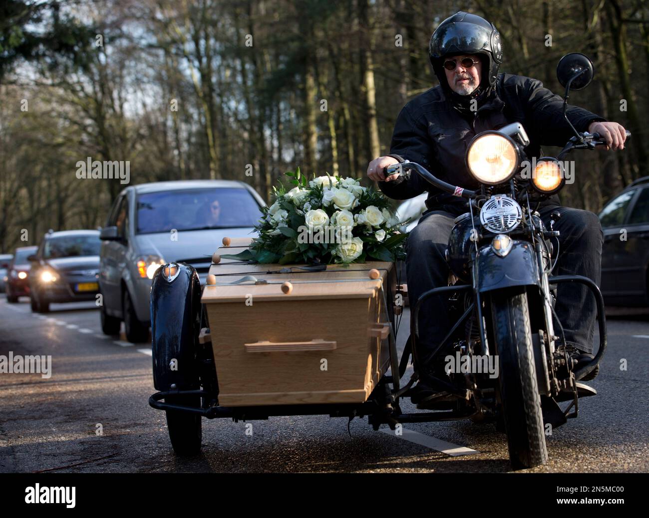 The casket of Ad van Antwerpen takes the last ride on a Harley Davidson ...