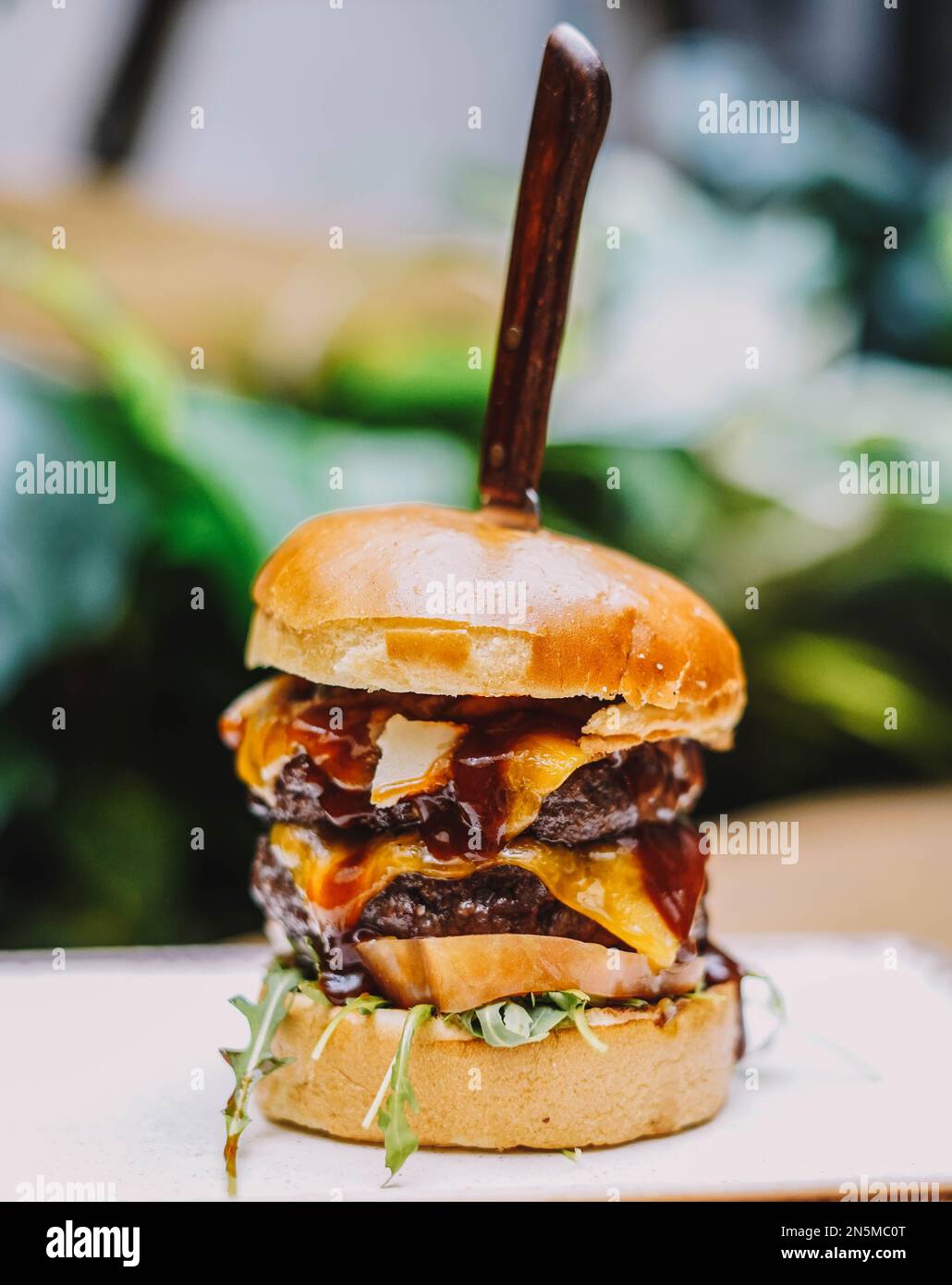 Tremendous double burger with extra cheddar cheese Stock Photo - Alamy