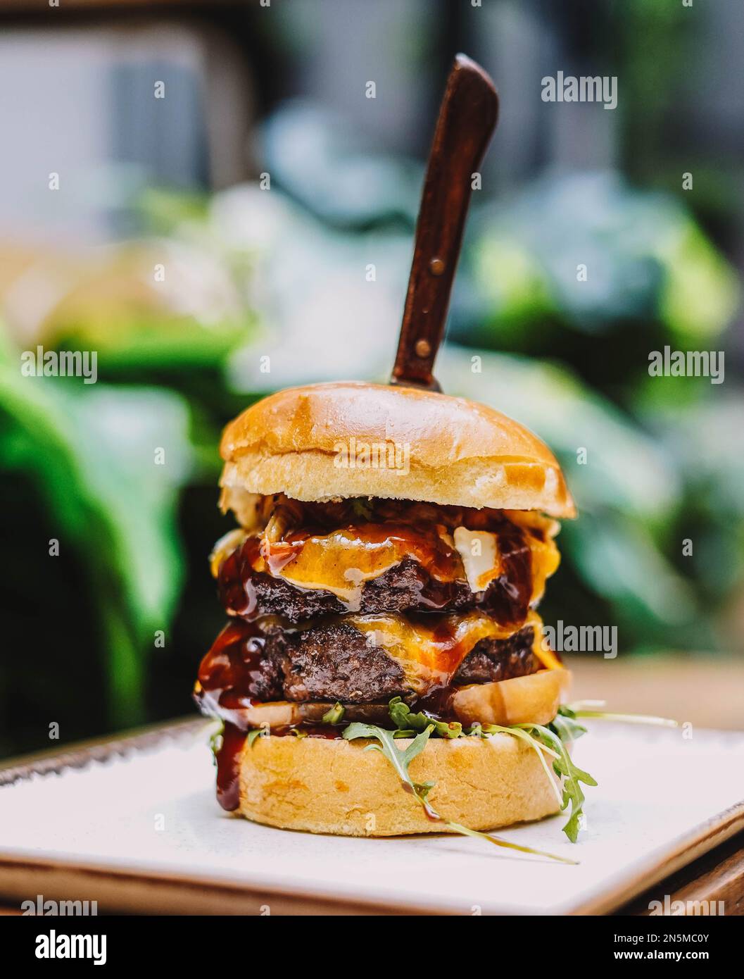 Tremendous double burger with extra cheddar cheese Stock Photo - Alamy