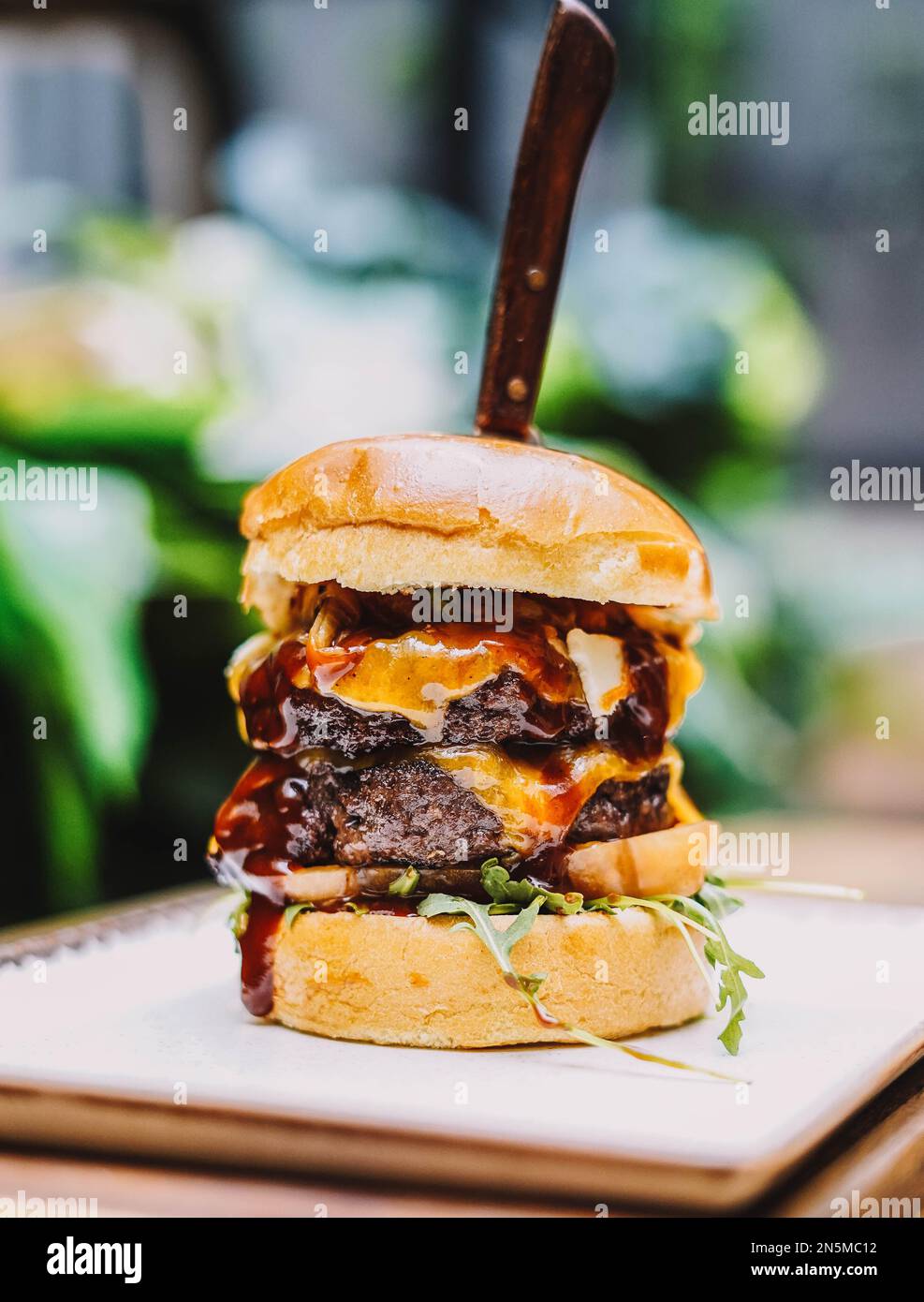 Tremendous double burger with extra cheddar cheese Stock Photo - Alamy