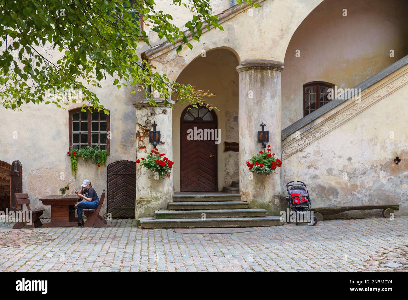 Autumn in medieval convent yard in old European town. Jaunpils, Latvia ...