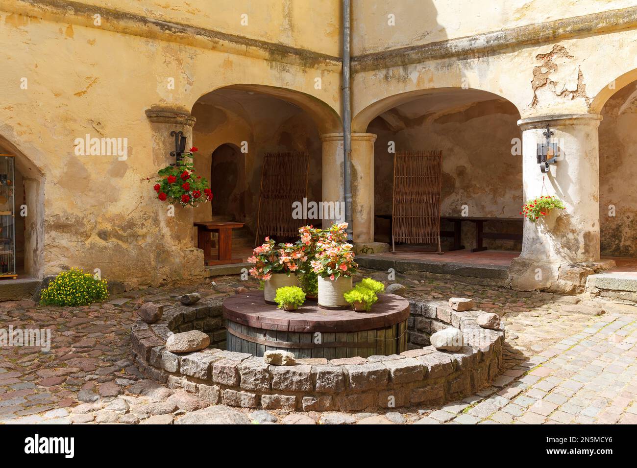 Autumn in medieval convent yard in old European town. Jaunpils, Latvia ...