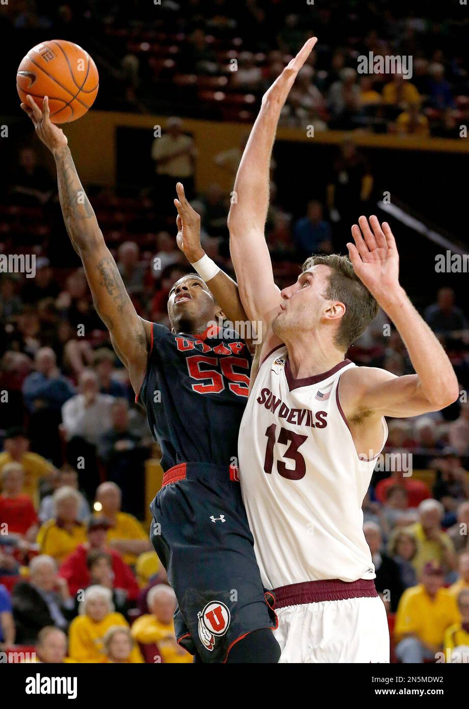 Utah's Delon Wright (55) tries to get off a shot over Arizona State's ...