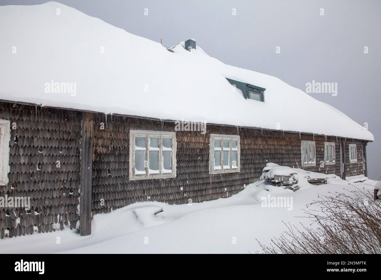 Old windows of a old mountain hut and gray wooden wall covered with ...
