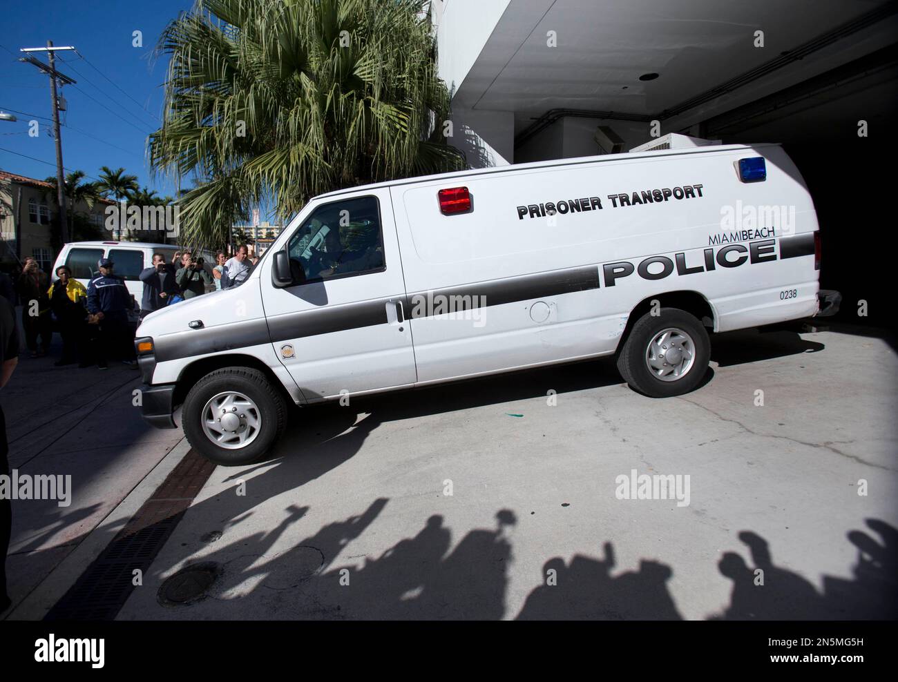 A Miami Beach, Fla., police prisoner transport van leaves the Miami ...