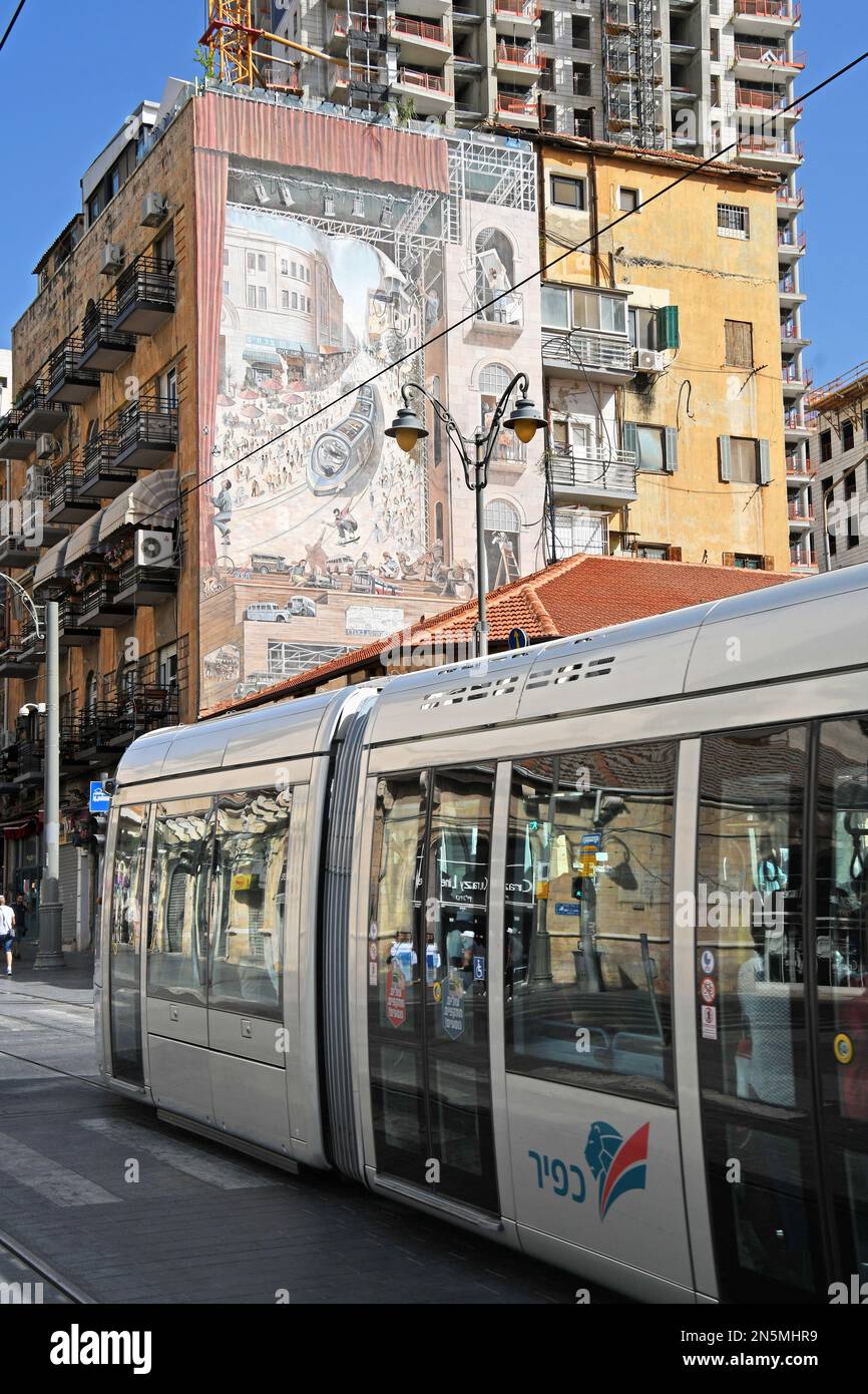 Light trainand a giant mural - Jerusalem, Israel Stock Photo - Alamy