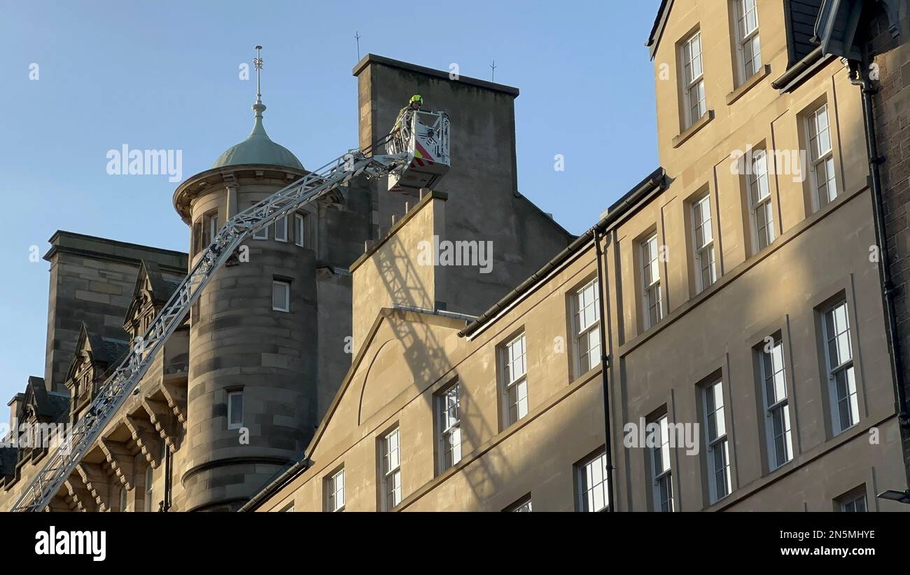 Firefighters attend to a fire on the Royal Mile in Edinburgh, Scotland ...