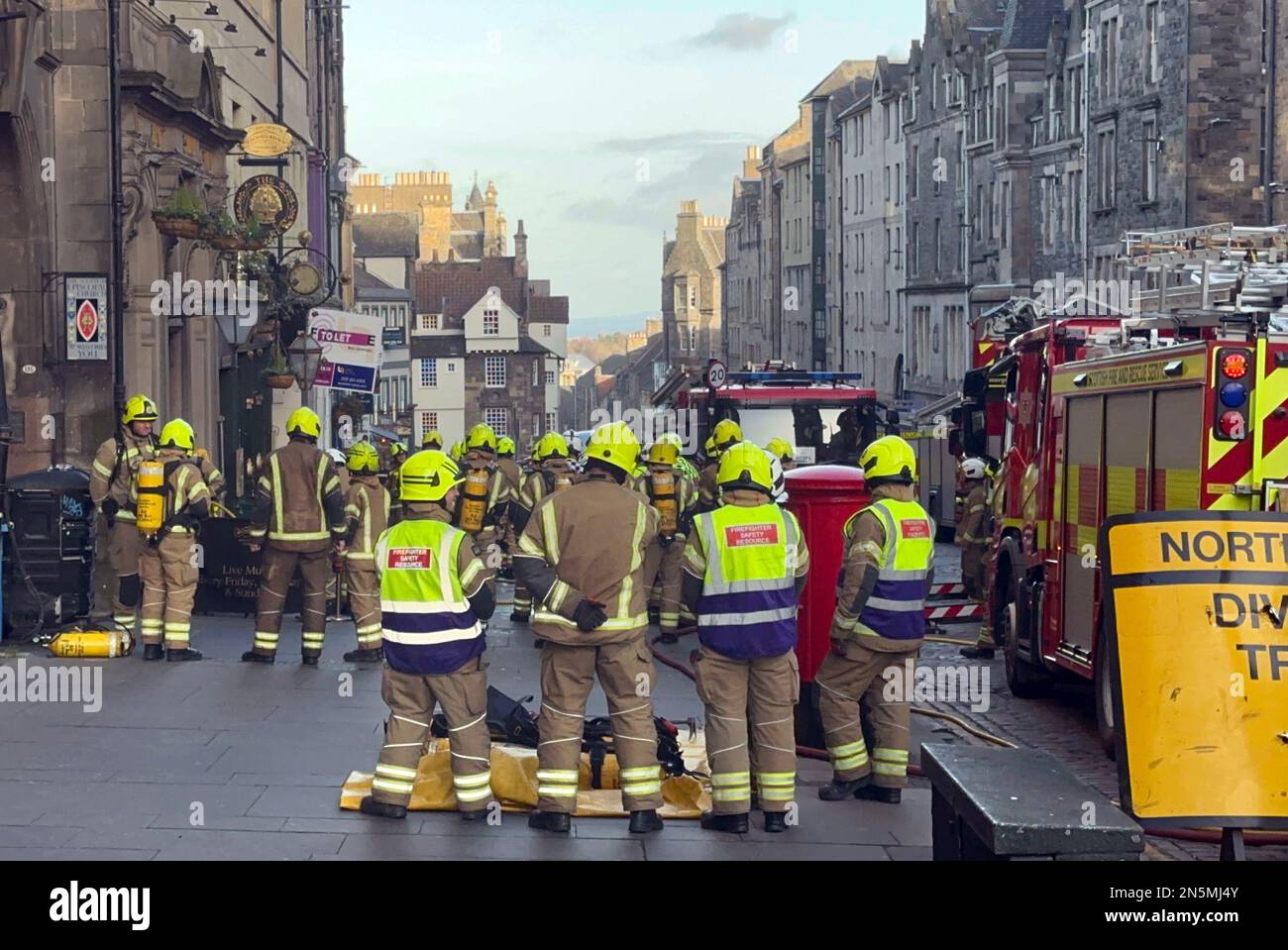Firefighters attend to a fire on the Royal Mile in Edinburgh, Scotland ...