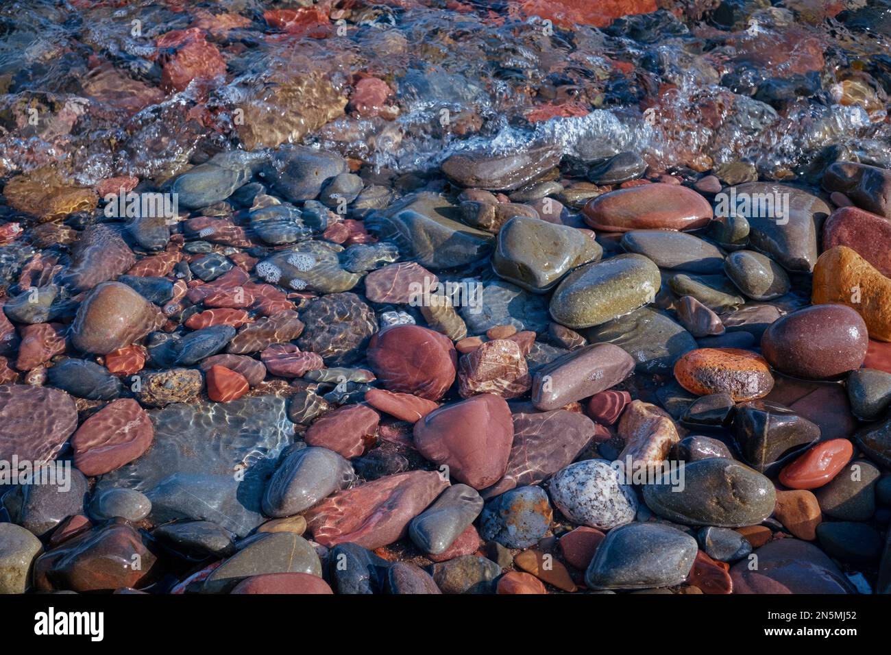 Stones at the edge of the sea on a beach in Scotland Stock Photo - Alamy