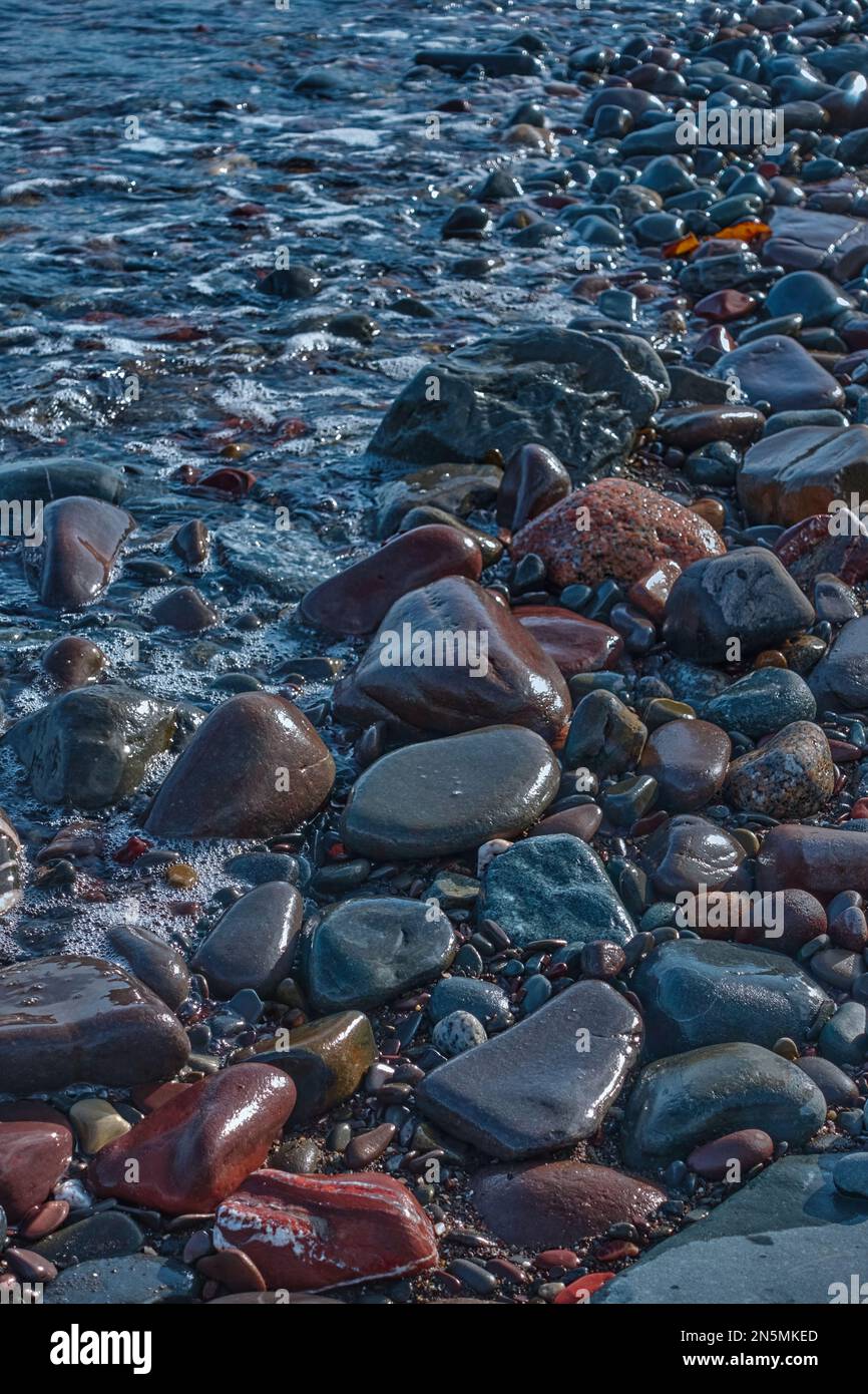 Stones at the edge of the sea on a beach in Scotland Stock Photo - Alamy