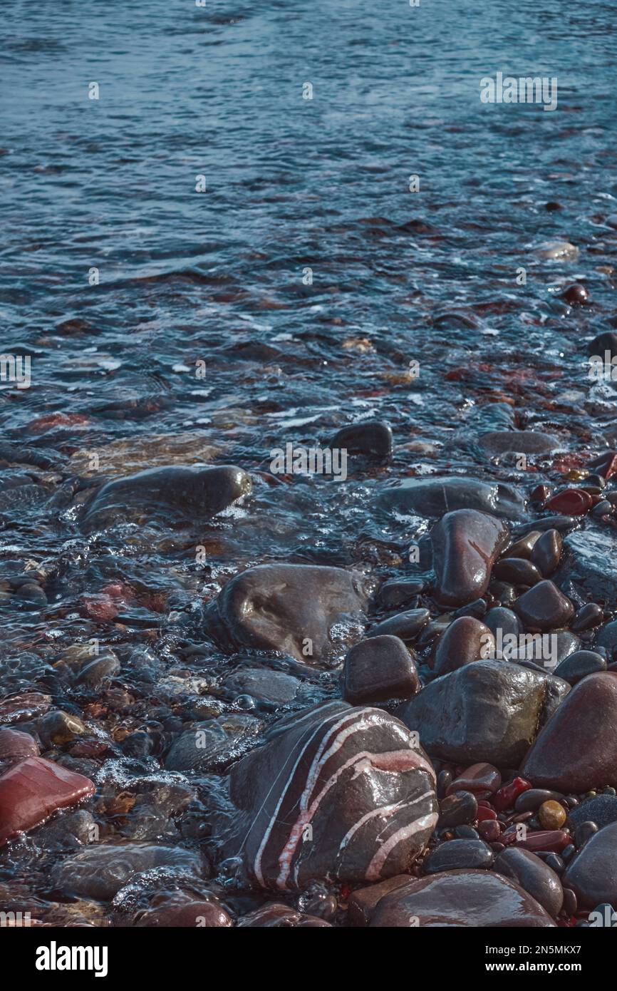 Stones at the edge of the sea on a beach in Scotland Stock Photo - Alamy