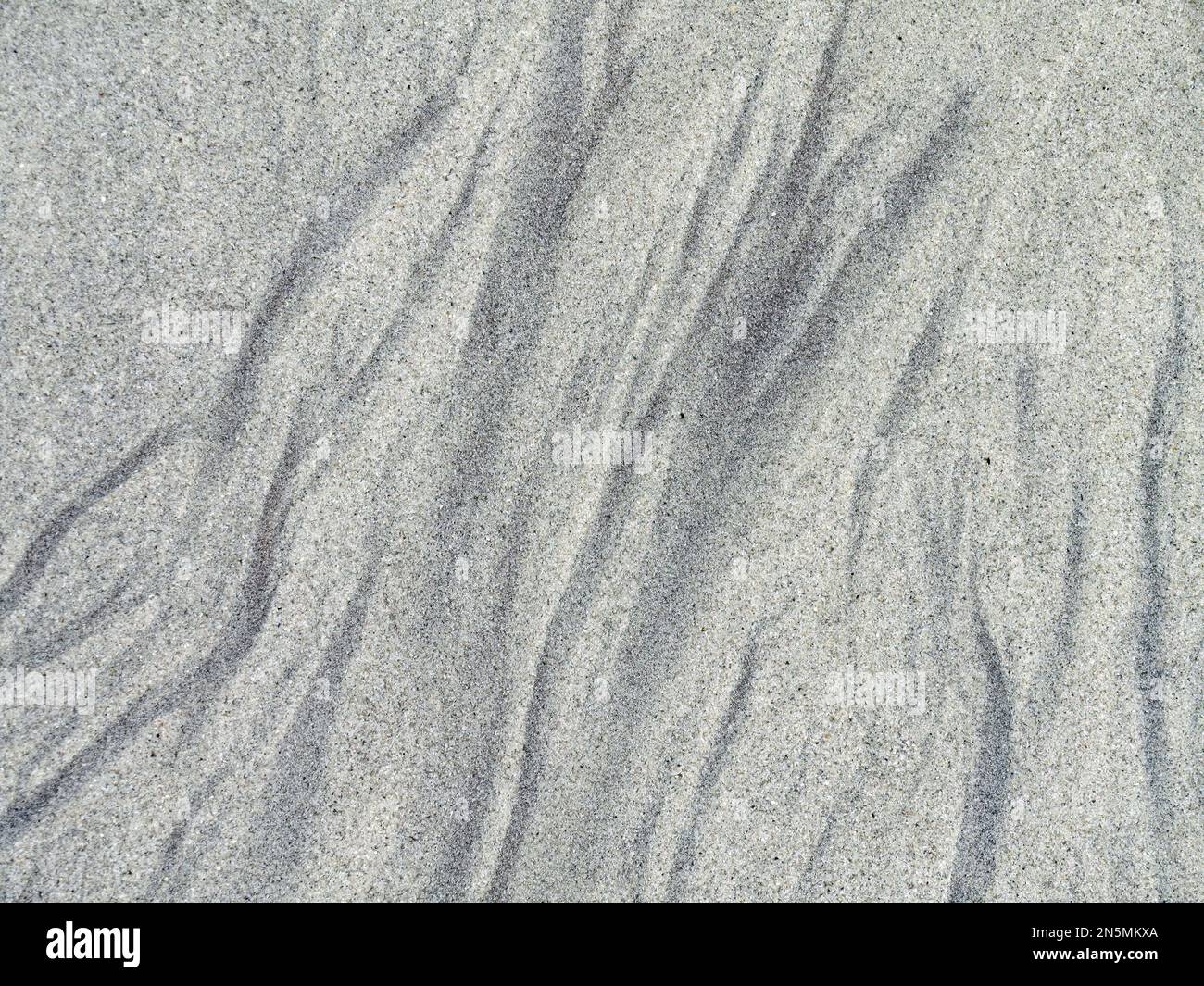 Beautiful lines drawn on the beach by the receding water Stock Photo ...