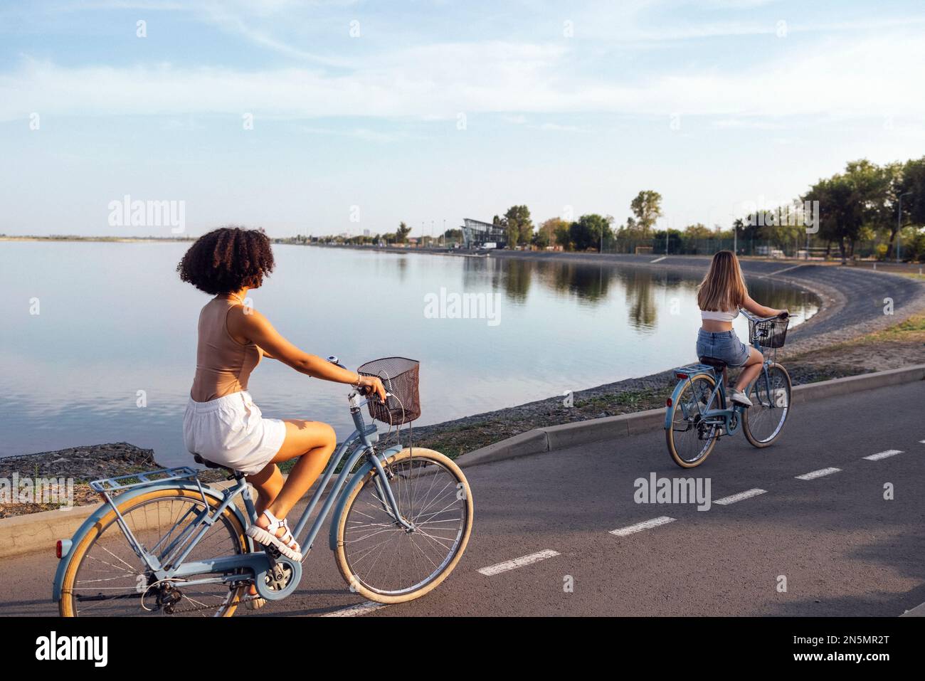 Teenagers of different nationalities and appearance on bicycles ride ...