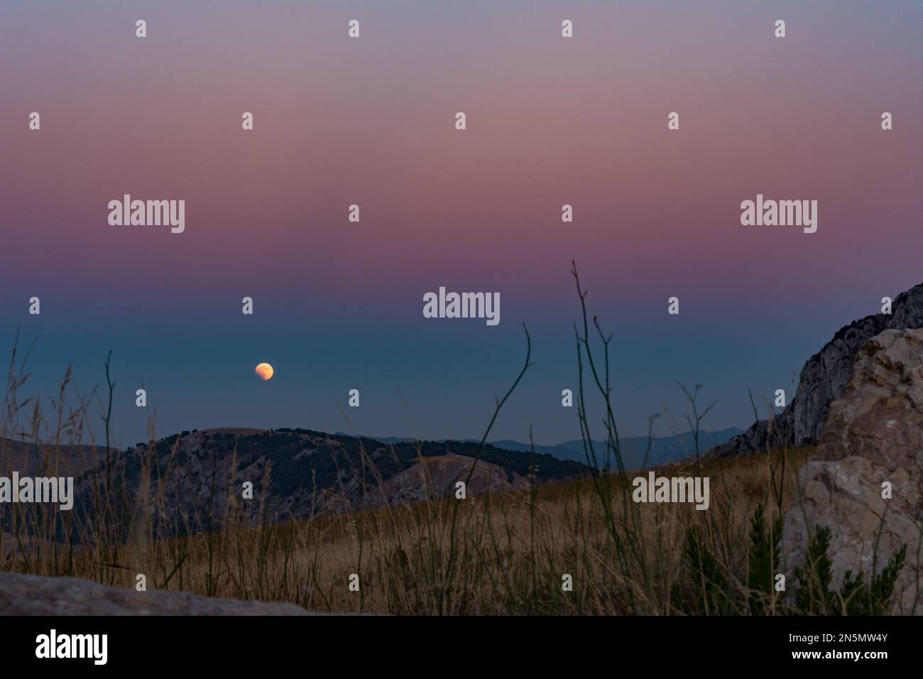 Moon rising behind the hill hi-res stock photography and images - Alamy