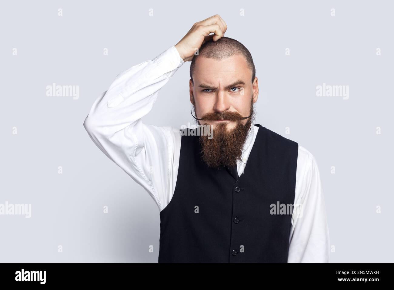 Portrait of pensive thoughtful handsome man with beard and mustache ...