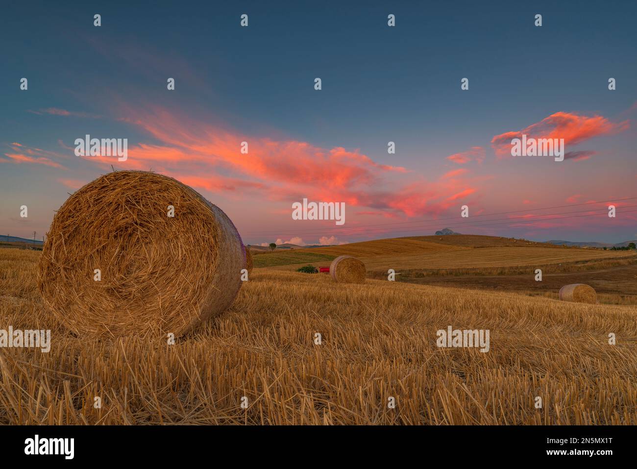 Hay bale field at dusk, Sicily Stock Photo - Alamy
