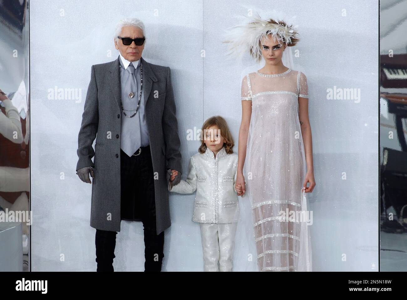 From left, German fashion designer Karl Lagerfeld, Hudson Kroenig, son ...