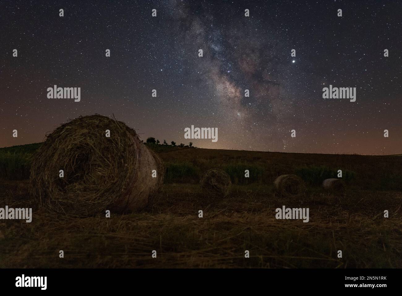 Night view with the milky way of a field of hay bales, Sicily Stock ...