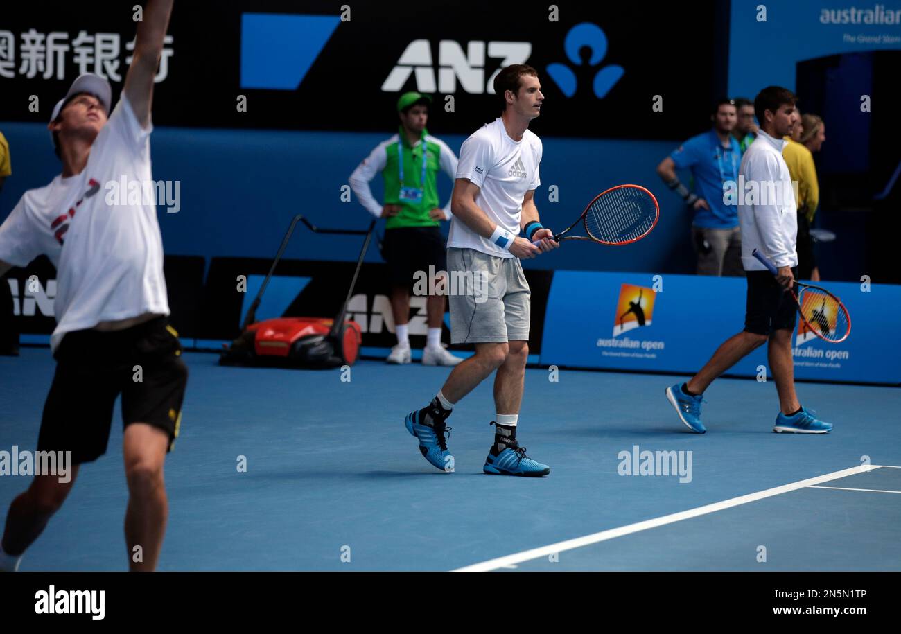 Andy Murray of Britain, center, warms up during a training session on ...