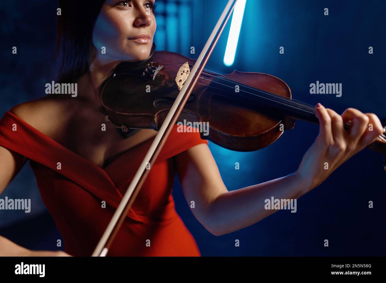 Closeup portrait of gorgeous elegant woman playing violin Stock Photo ...