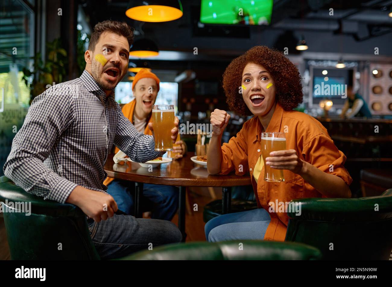 Diverse sports fans cheering hi-res stock photography and images - Alamy