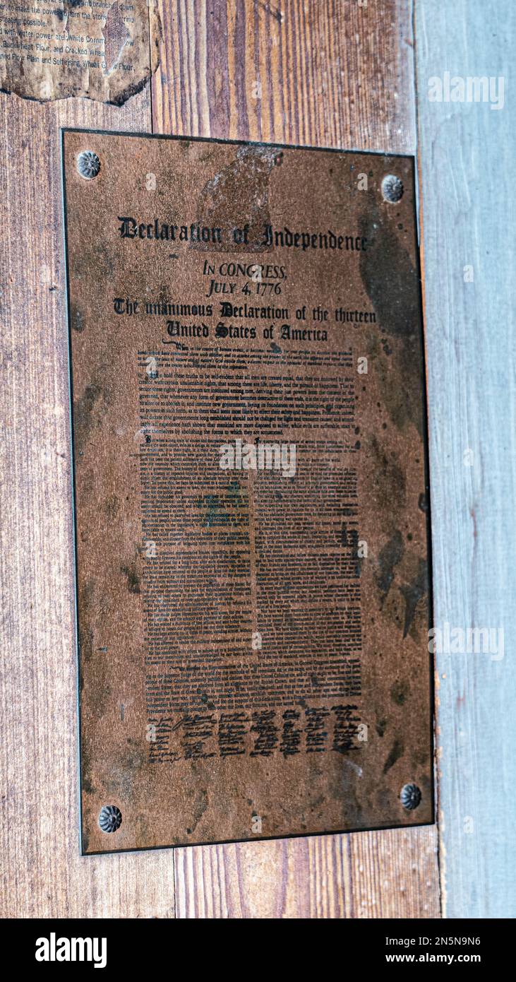 A vertical shot of a metal replica of the Declaration of Independence ...