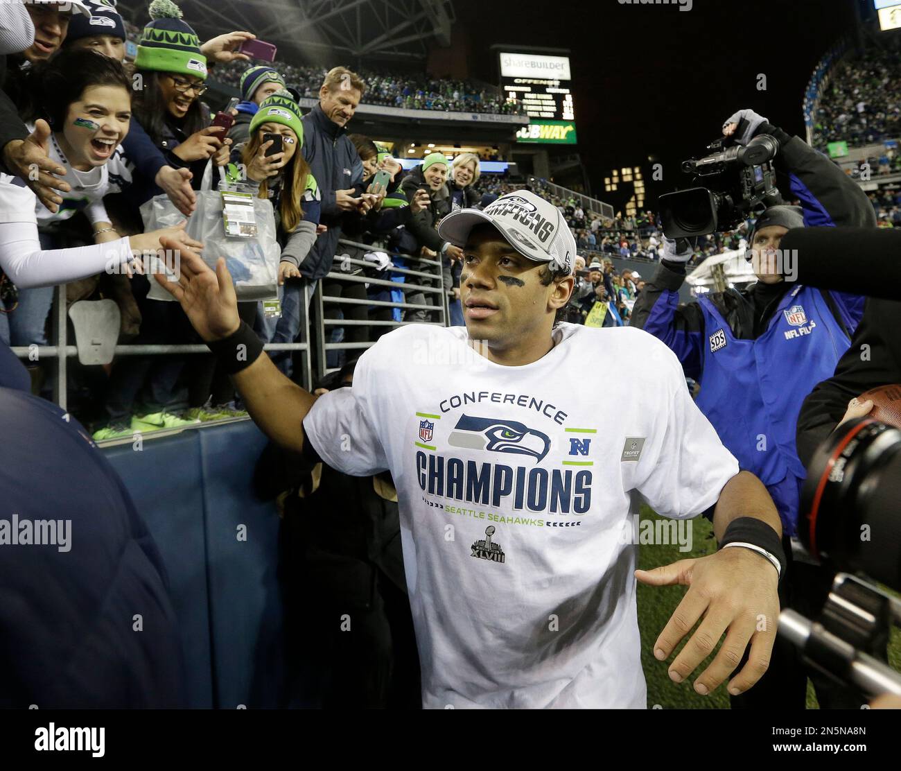 Seattle Seahawks' Russell Wilson celebrates with fans after the NFL ...