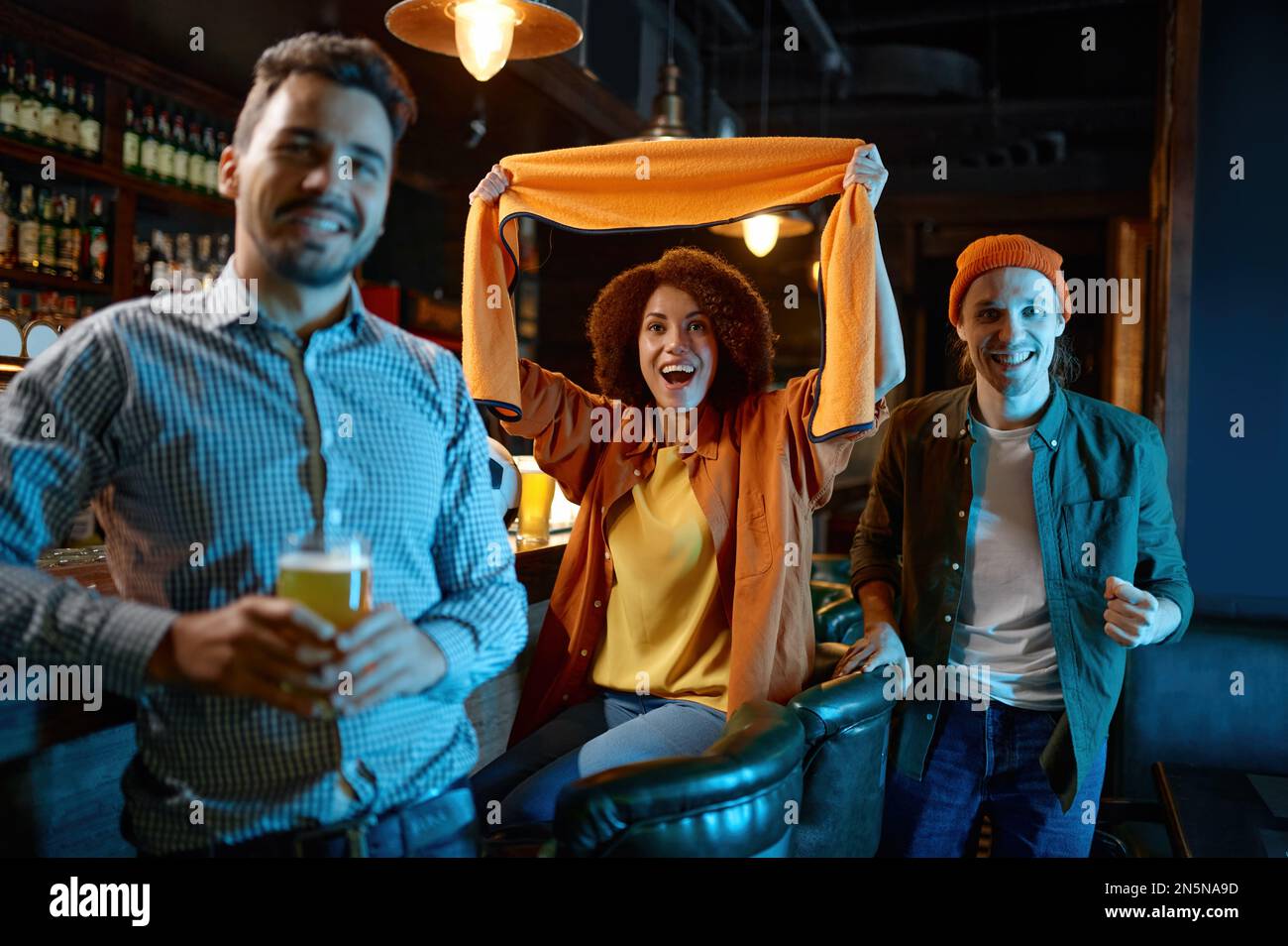 Surprised young people football fan cheering to support favorite team ...