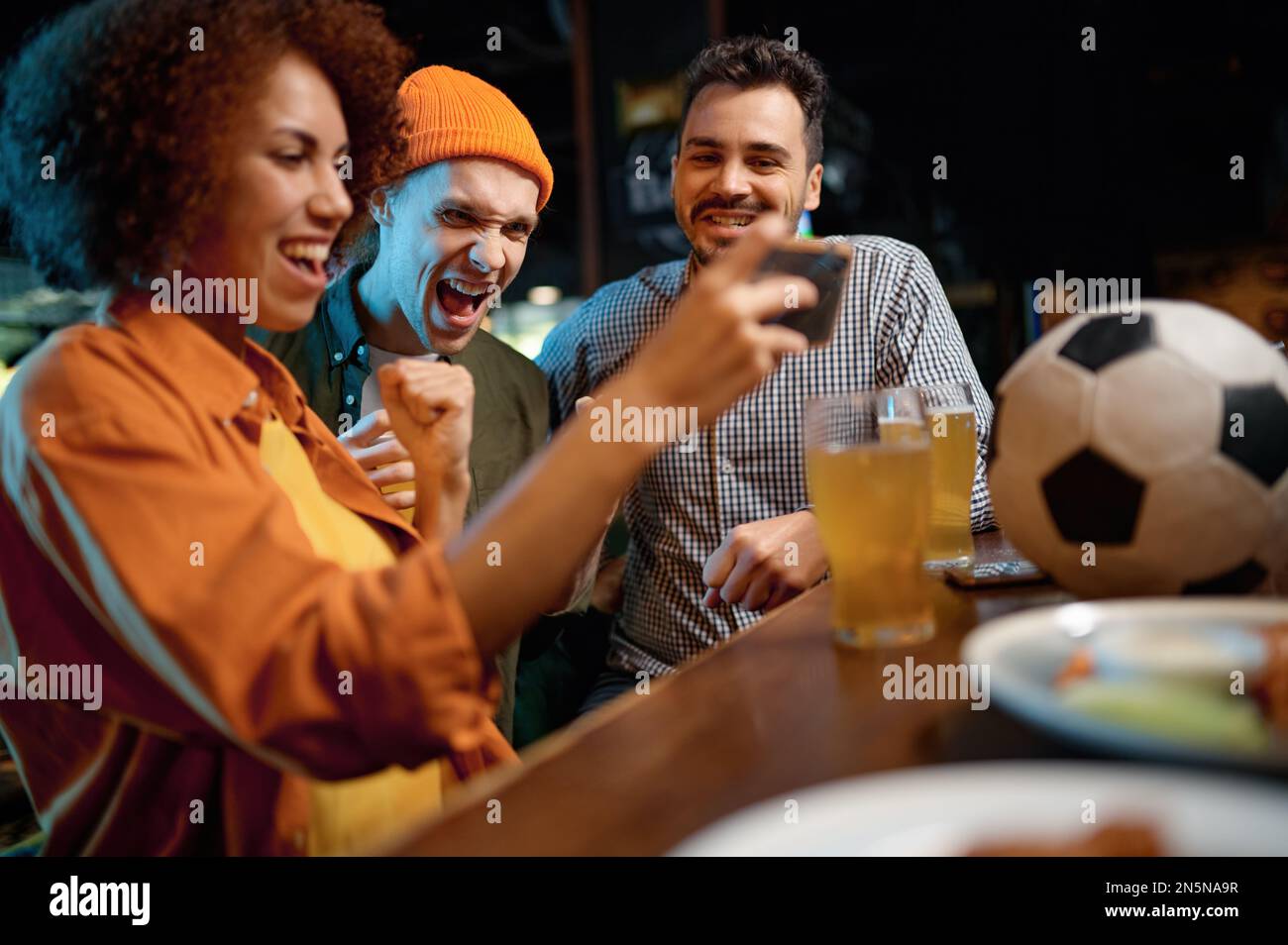 Man streaming football phone hi-res stock photography and images - Alamy