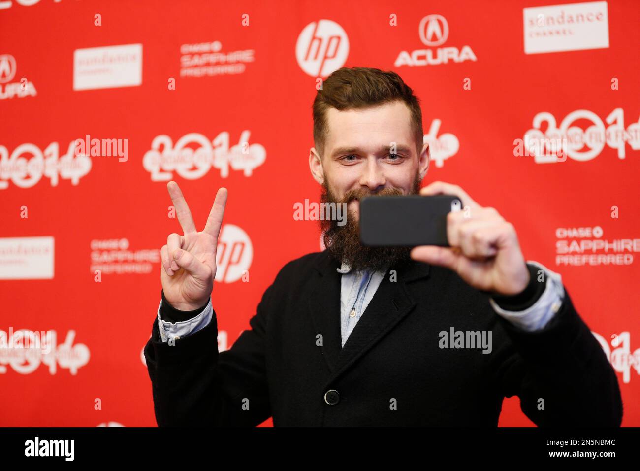 Cast member Grigoriy Dobrygin records with his mobile phone at the ...