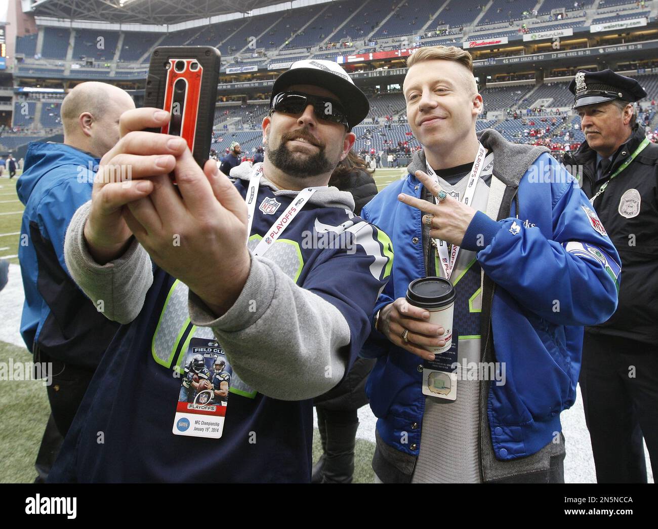 Rapper Macklemore, right, has his picture taken with Eric Mathews ...