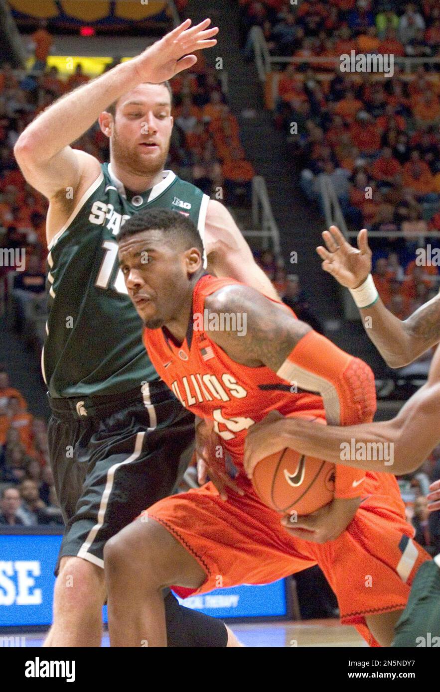 Illinois' Rayvonte Rice (24) drives on Michigan State's Matt Costello ...
