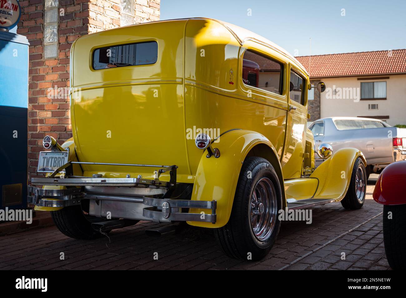 A detail of the rear of a "tweety" yellow hot rod based on a Ford Model ...