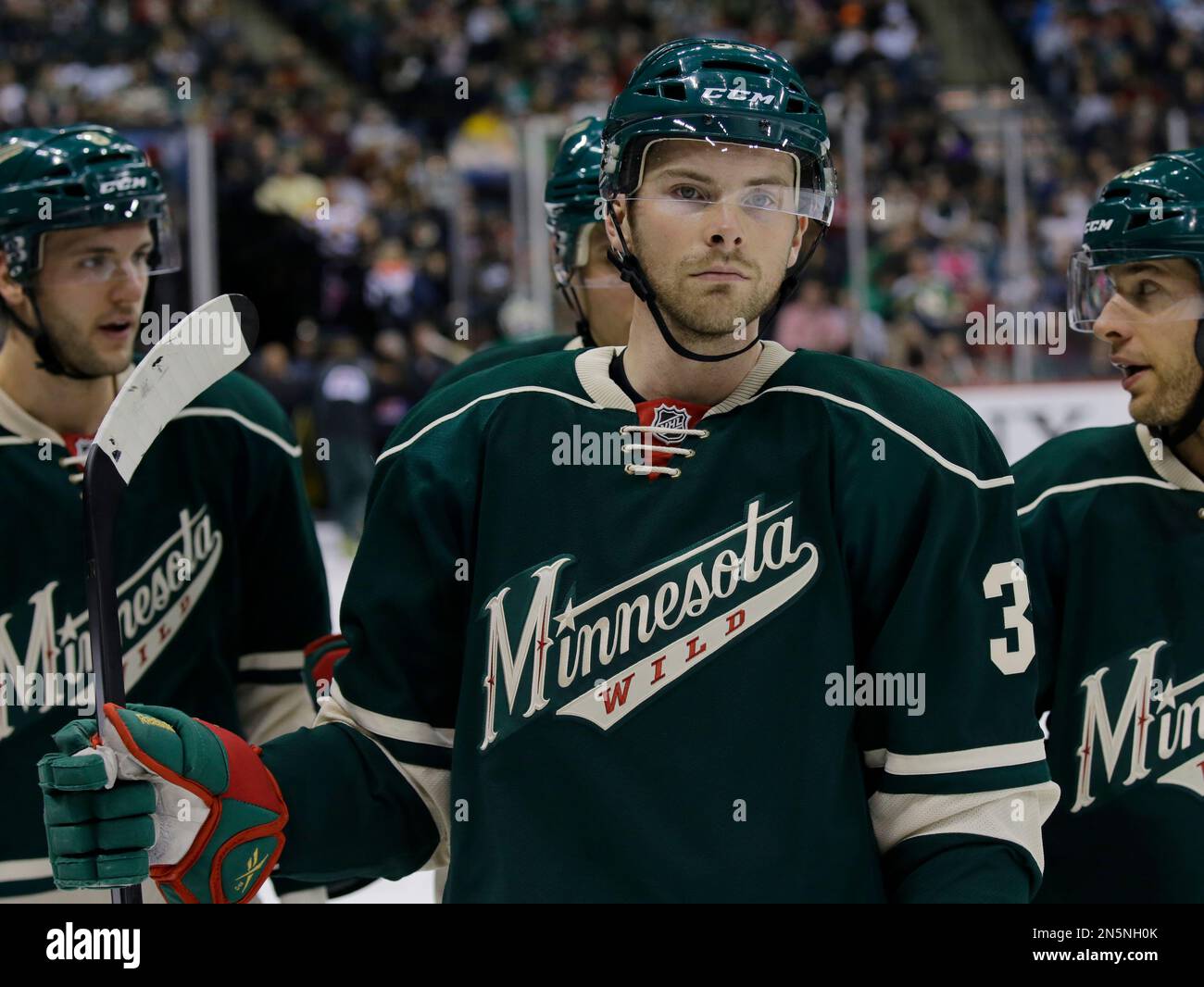 Minnesota Wild defenseman Nate Prosser (39) stands by the bench at a ...